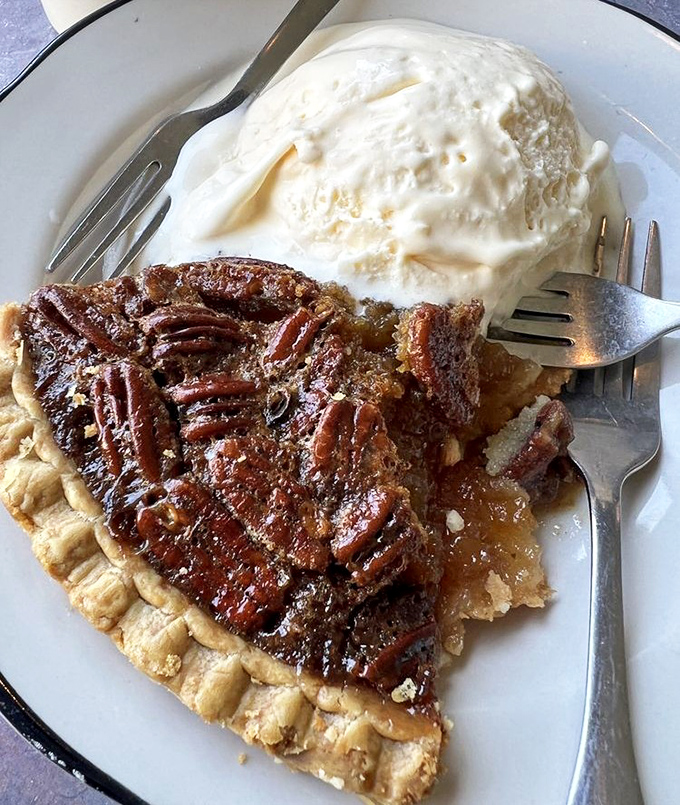 Pecan pie that's achieved the impossible balance: gooey without being cloying, sweet without being overwhelming, and impossible to eat without closing your eyes.