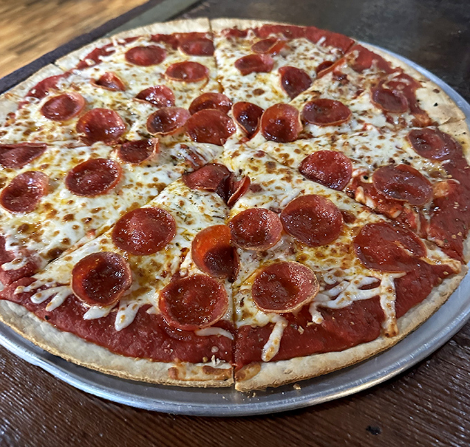 Pizza that proves Sloppy Hog isn't just a one-trick pony. Those pepperoni cups holding tiny pools of flavor are like little hot tubs for your taste buds.
