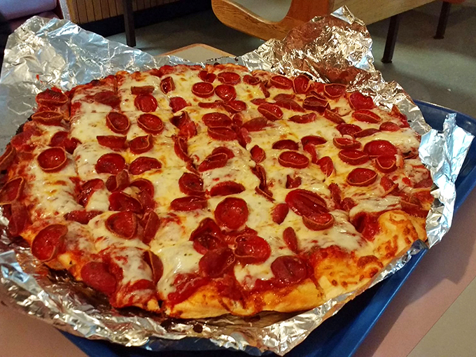 The pepperoni cups like tiny flavor reservoirs, each one collecting a precious pool of spiced oil. This isn't just food&mdash;it's edible engineering at its finest. 