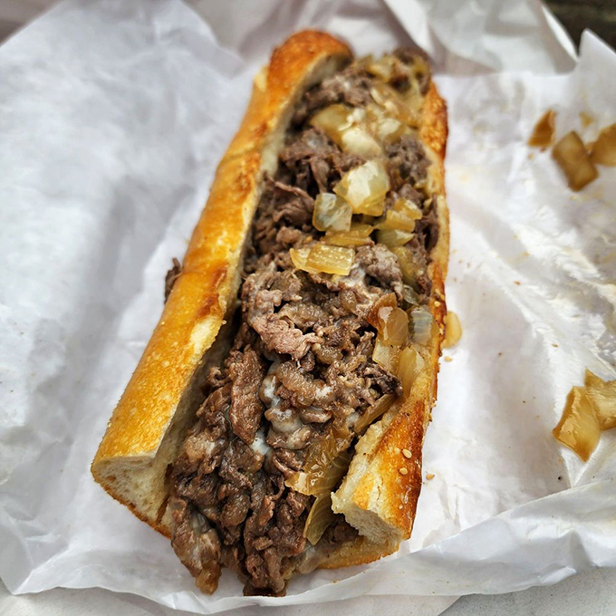 Behold the Philly cheesesteak in its natural habitat. Thinly sliced ribeye and caramelized onions cradled in a roll that's both sturdy and tender.