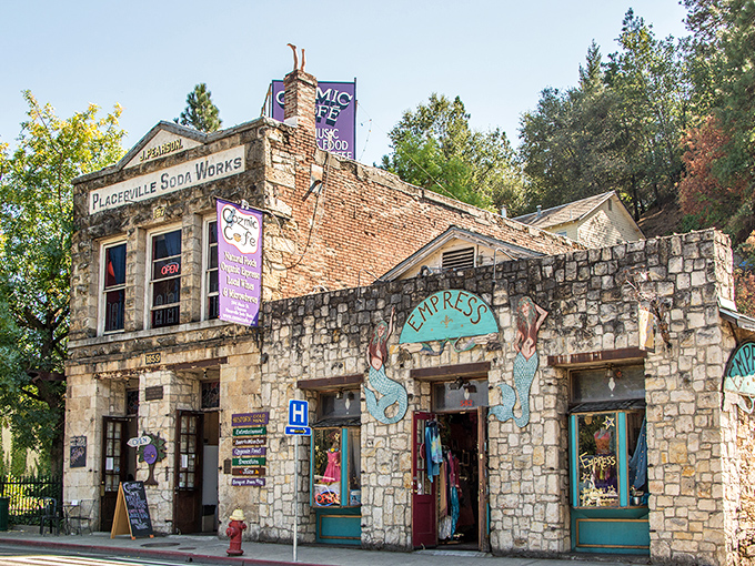 The Placerville Soda Works building stands as a stone testament to history, now housing modern businesses behind its weathered 19th-century facade.