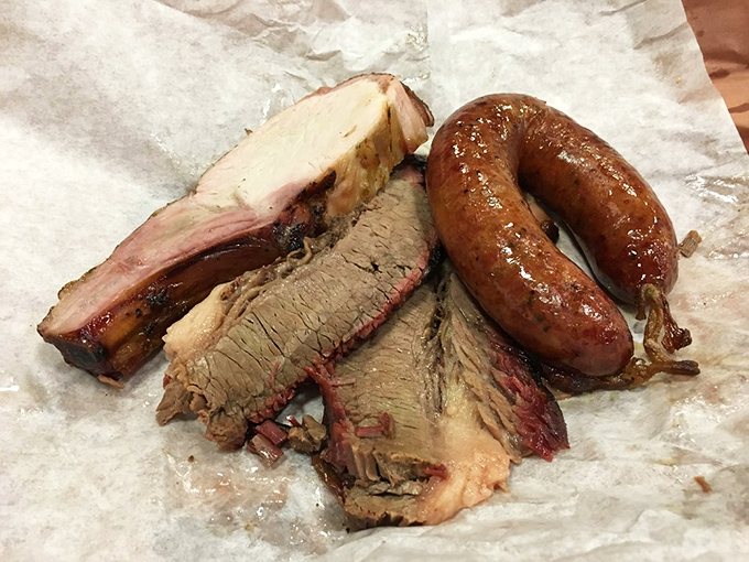 Meat architecture at its finest. These layers of pork and beef tell a story of patience, smoke, and the kind of craftsmanship that makes Texans misty-eyed.