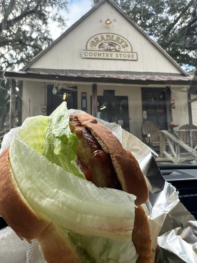 The pork chop sandwich arrives like a meaty masterpiece, juicy and satisfying beyond words.