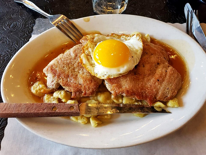 Schnitzel topped with a sunny-side-up egg is the breakfast-for-dinner champion we all need. Those hash browns underneath are the unsung heroes.