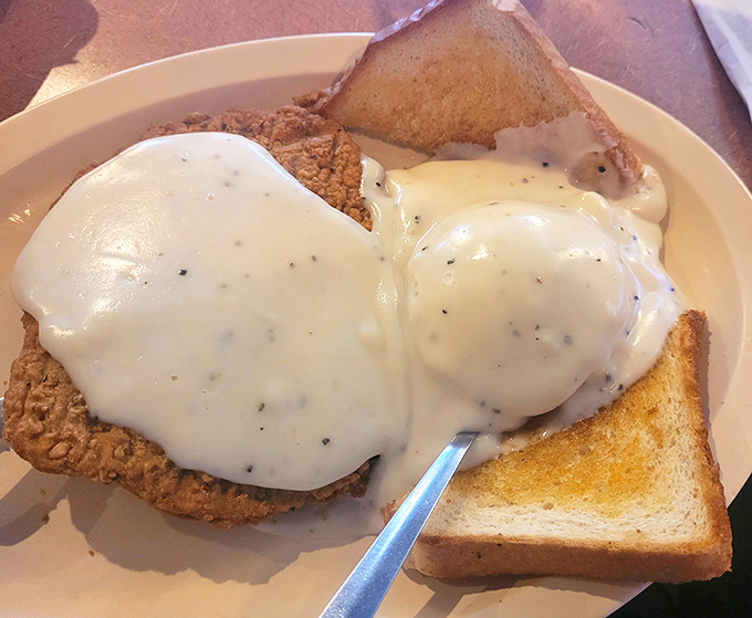 Country-fried heaven smothered in gravy so good you'll want to write home about it. Comfort food that hugs your soul from the inside.