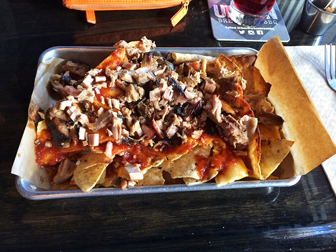 BBQ nachos that laugh in the face of restraint &ndash; a glorious mess of chips, cheese, and smoky meat that demands to be shared but tempts you not to.