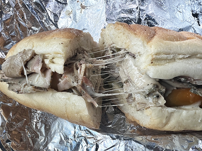 The porketta hoagie: where melted cheese stretches like your favorite sweatpants after Thanksgiving dinner. A sandwich worth the drive from Philadelphia.