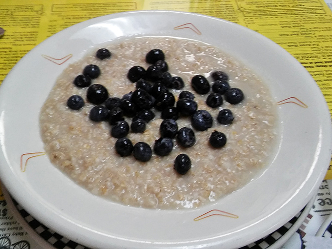 The humble porridge that launched a thousand return visits. Those blueberries aren't just toppings&mdash;they're little bursts of morning joy in a sea of creamy comfort.