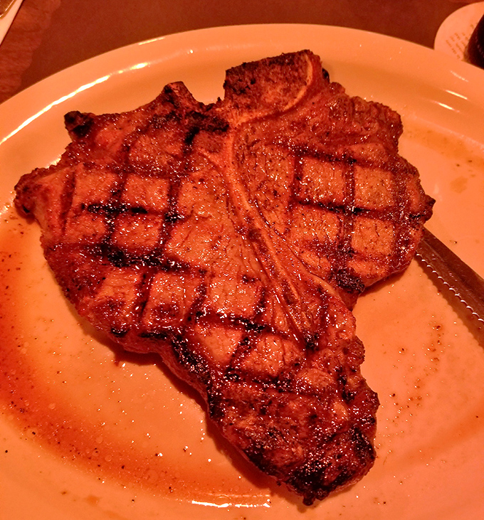 The porterhouse doesn't just arrive at your table—it makes an entrance, with grill marks that deserve their own Ohio historical marker.