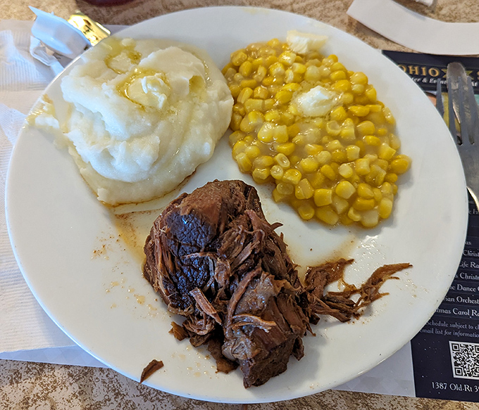 Pot roast so tender it surrenders at the mere suggestion of your fork, accompanied by corn that tastes like summer sunshine and mashed potatoes worthy of poetry.
