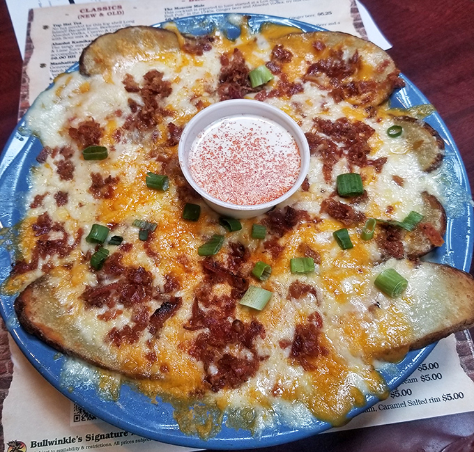 Potato skins that didn't get the memo about being a humble appetizer. That melted cheese and bacon combo is performing a happiness concert in your mouth.