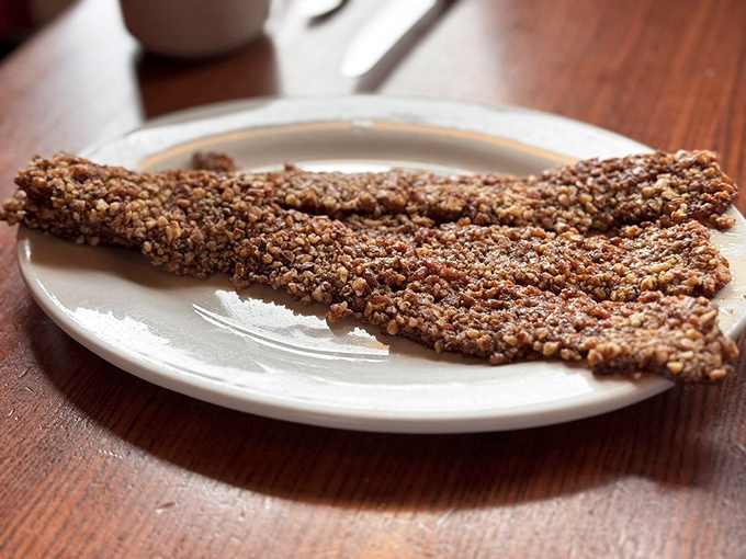 Praline bacon: where breakfast meat transcends to candy territory. Crispy, sweet, nutty perfection that makes you question why all bacon isn't treated this way.