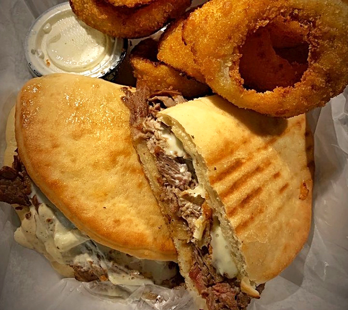 This panini isn't just a sandwich; it's architecture. Layers of savory goodness pressed between perfectly grilled bread&mdash;the ultimate comfort food upgrade.