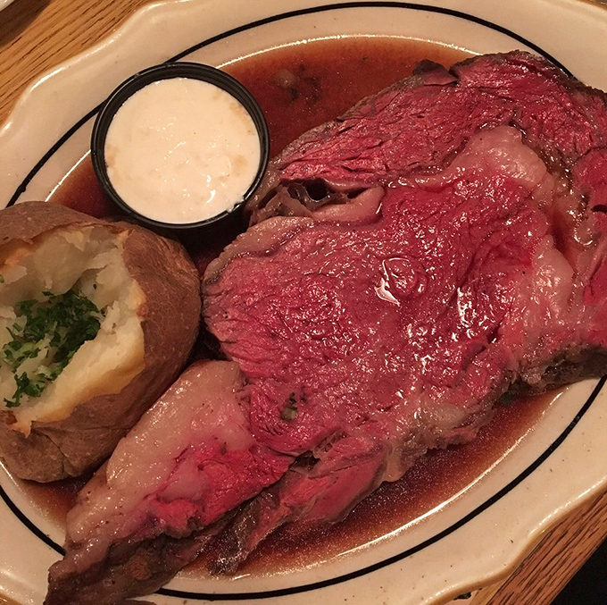 Prime rib so perfectly pink it makes flamingos jealous, swimming in jus that should be bottled and sold as liquid happiness.
