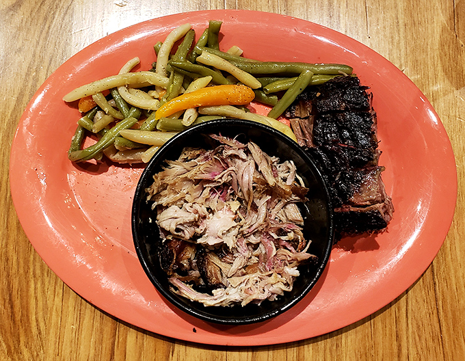 Pulled pork that actually earned its diploma in tenderness. Paired with green beans that didn't come from any ordinary can—a plate of pure satisfaction.