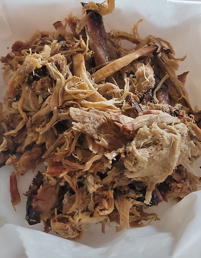Pulled pork perfection: tender strands of smoky meat with bits of flavorful bark mixed throughout. This is what barbecue dreams are made of.