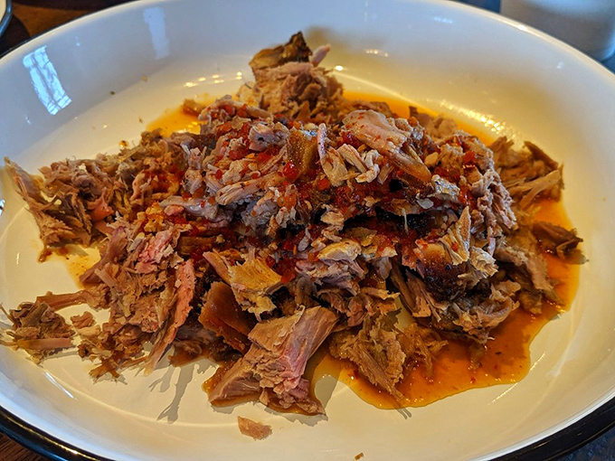 Pulled pork that practically melts on contact&mdash;tender, juicy, and swimming in a sauce that balances tang and sweetness like a culinary tightrope walker.