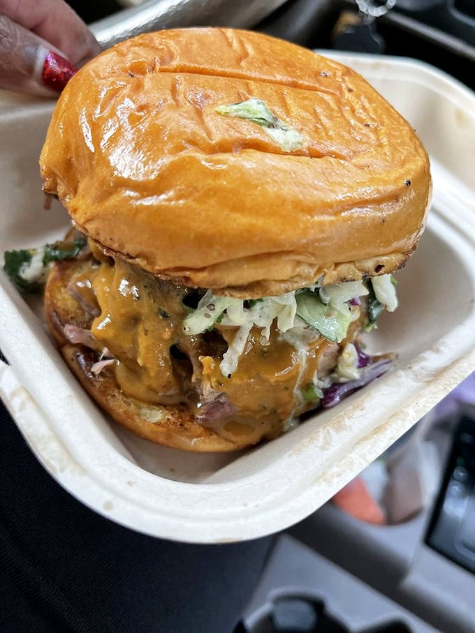 This isn't just a sandwich&mdash;it's an architectural marvel of pulled pork, slaw, and sauce that requires both hands and several napkins.