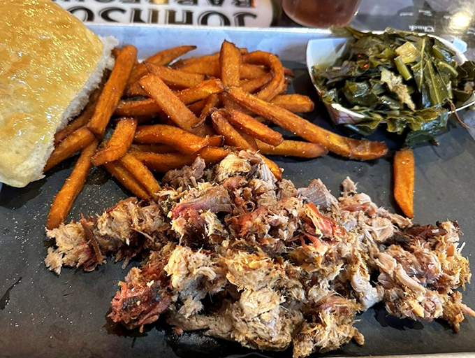 Pulled pork that's clearly been introduced to smoke and time&mdash;the two best friends meat can have. Those sweet potato fries and collards aren't just sides, they're supporting actors deserving of awards.