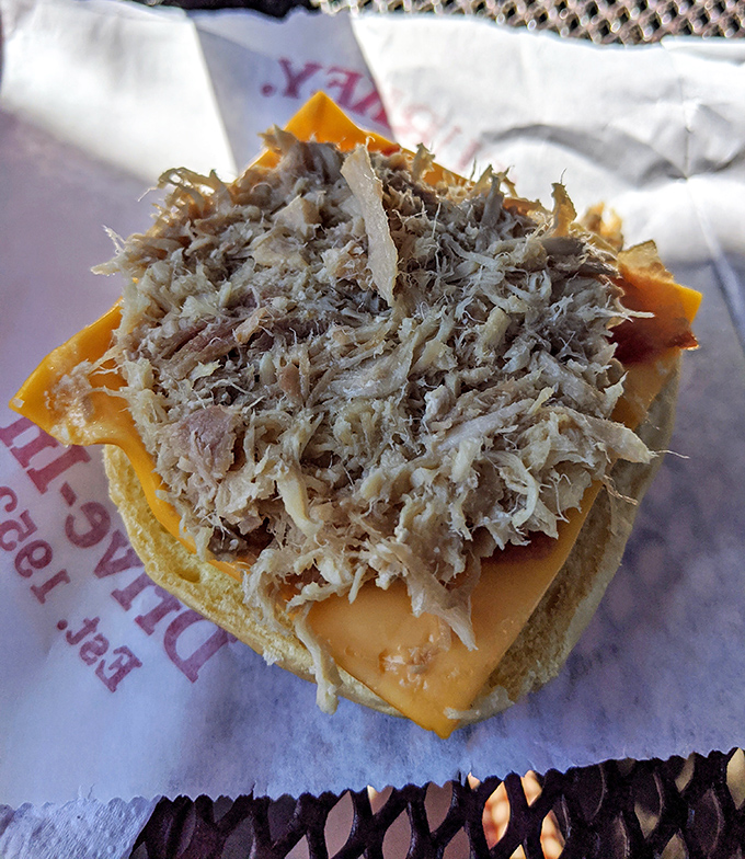Behold the turkey sandwich in its natural habitat—shredded, not sliced, with cheese melted just so. This isn't lunch; it's edible nostalgia that makes you wonder why you ever ate turkey any other way.