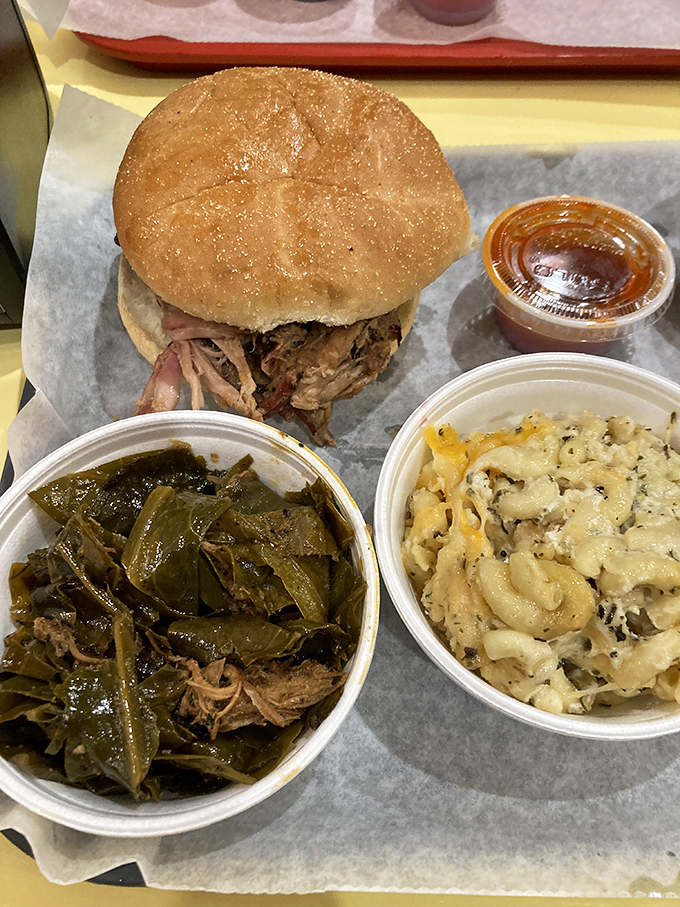 The holy trinity of barbecue bliss: pulled pork sandwich, collard greens, and mac 'n cheese. Name a more perfect trio&mdash;I'll wait.
