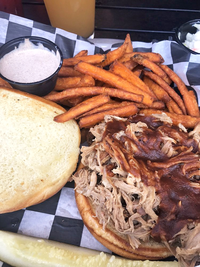 Pulled pork meets sweet potato fries in a combination that defies all logic yet makes perfect sense.