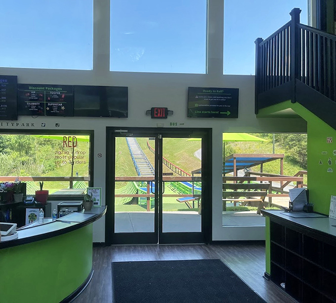 The adventure begins here, where the reception area's bright green accents hint at the not-so-serious fun waiting just beyond those doors.