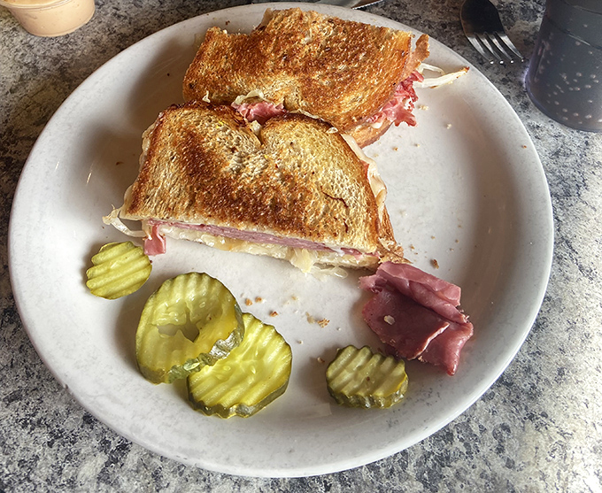 The Reuben doesn't need fancy plating to prove its worth. That perfectly grilled marble rye and generous filling speak the universal language of sandwich perfection.
