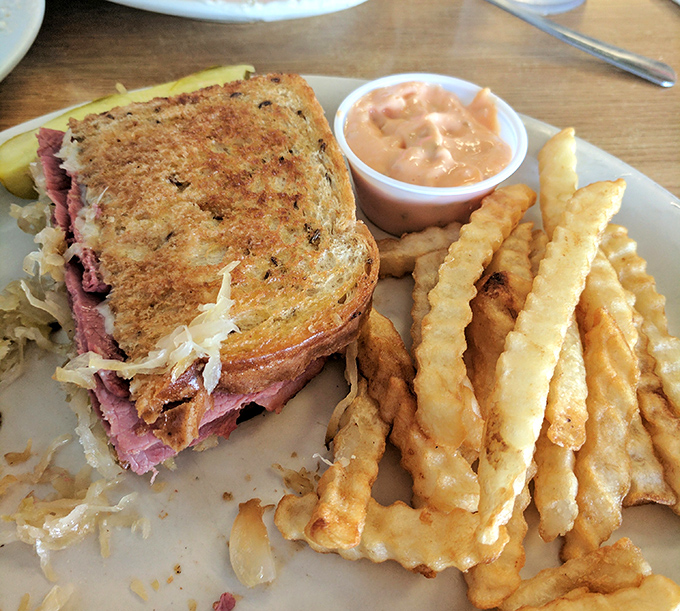 A proper Reuben doesn't need fancy tricks—just perfectly grilled rye, melty cheese, and enough corned beef to make you consider a post-lunch nap.