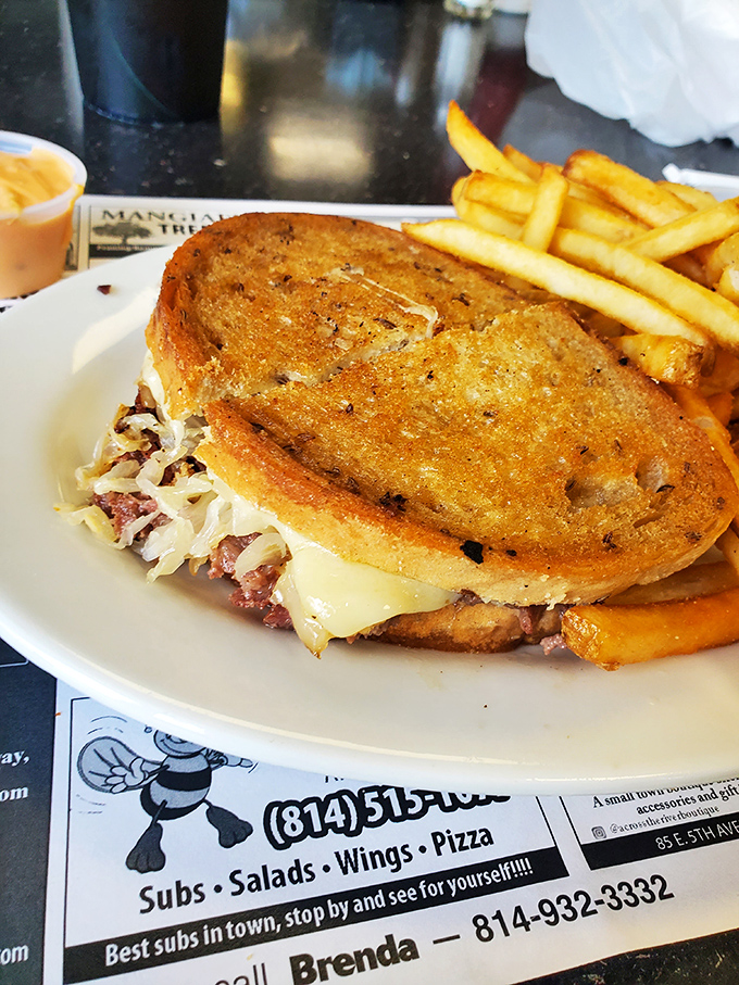The Reuben sandwich &ndash; a masterpiece of corned beef, sauerkraut, and melted Swiss that demands both hands and several napkins.