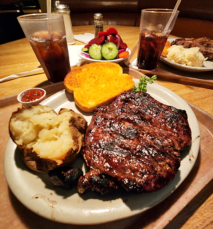 This ribeye's char marks tell a story of fire, flavor, and the kind of satisfaction money can't buy.