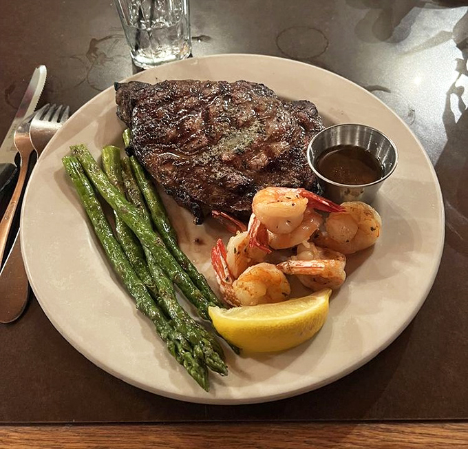 This isn't just a steak—it's a masterclass in the art of beef. The asparagus and shrimp are just supporting actors to this star.