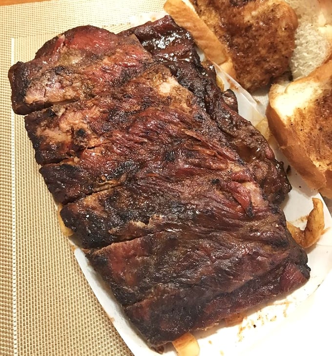 Smoke rings don't lie. These ribs have spent quality time with hardwood smoke, resulting in a bark that's practically musical.
