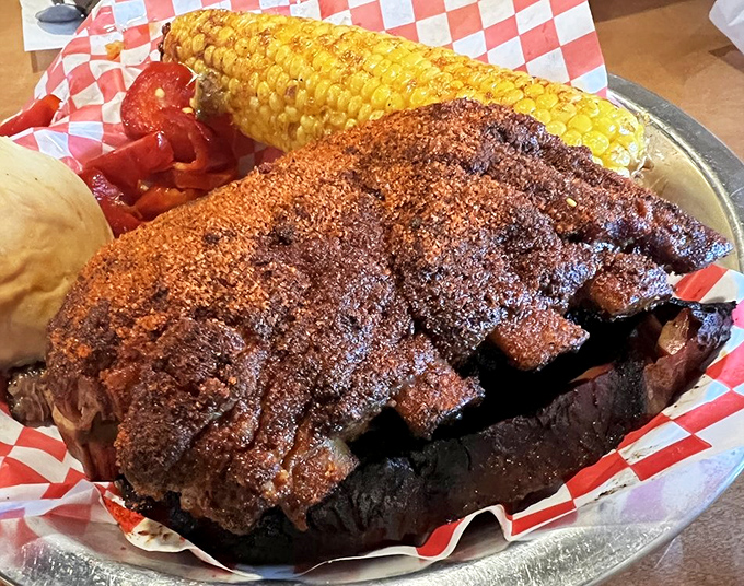 Ribs so perfectly crusted and tender they make you question why humans evolved beyond simply gathering around fire and meat.