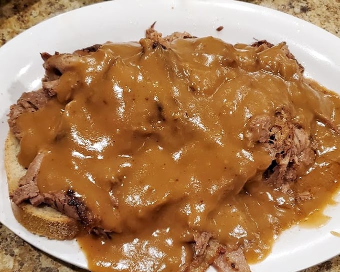 This open-faced roast beef sandwich isn't just comfort food &ndash; it's a warm hug from your grandmother if she had a PhD in gravy-making.