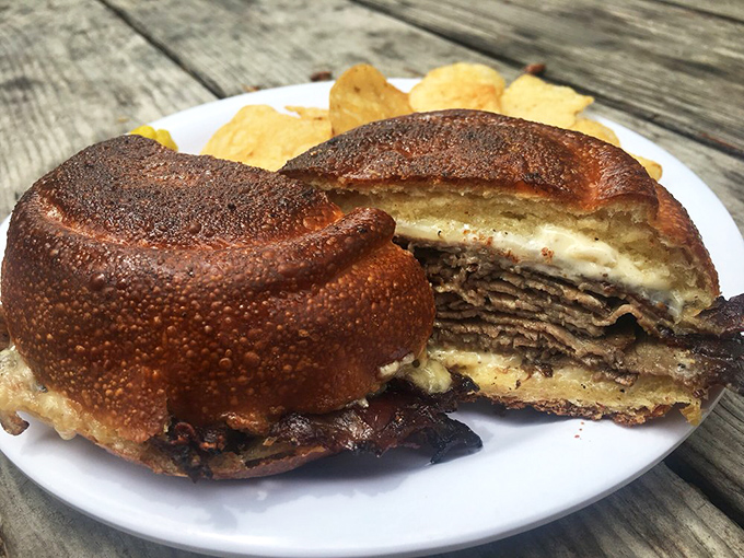 This isn't just a sandwich&mdash;it's architecture. Layers of house-roasted beef stacked with precision that would make Frank Lloyd Wright nod in approval.