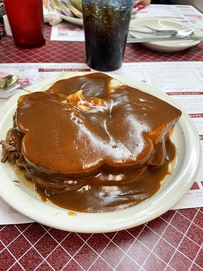 Gravy isn't a condiment here&mdash;it's a philosophy. This hot roast beef sandwich doesn't just satisfy hunger; it reconciles you with the universe.