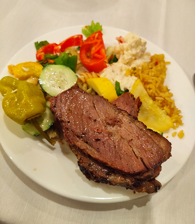 Medium-rare perfection shares the plate with colorful sides&mdash;proof that buffet food doesn't have to sacrifice quality for quantity.