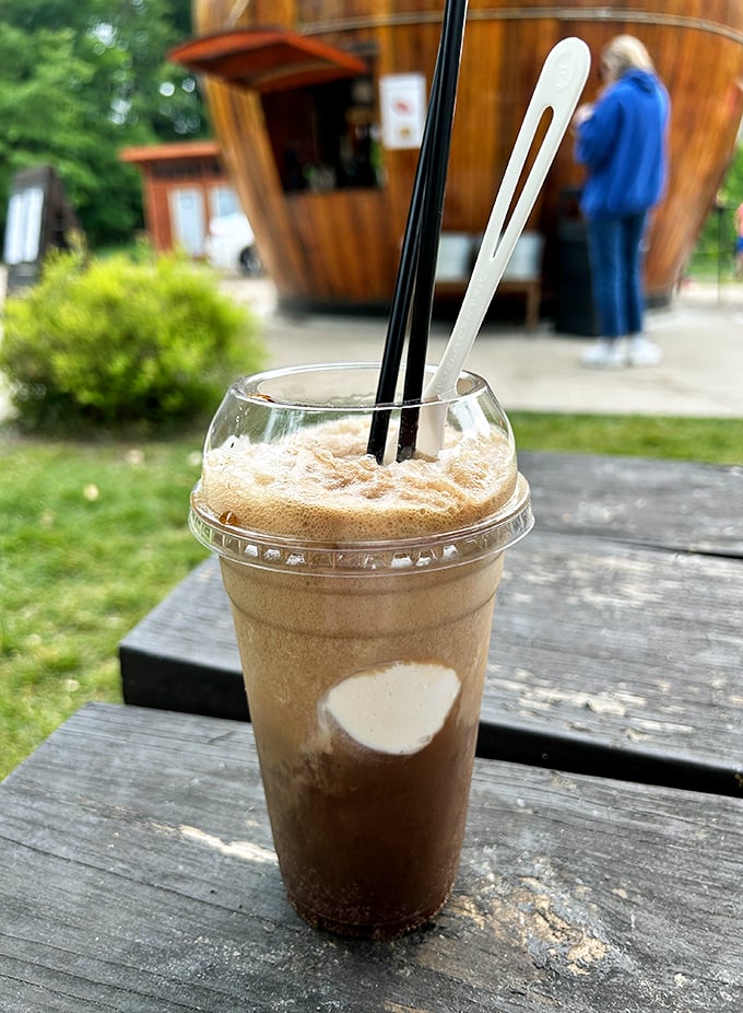The root beer float: where childhood nostalgia and adult appreciation meet in perfect, frothy harmony against a backdrop of barrel-shaped dreams.