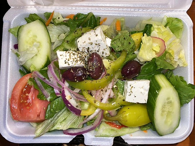 A Greek salad that respects the classics&mdash;crisp vegetables, briny olives, and feta cheese that hasn't forgotten its Mediterranean roots.