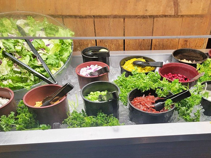 A salad bar that actually deserves respect&mdash;fresh, vibrant ingredients waiting to balance out your carnivorous main course. Guilt management at its finest.