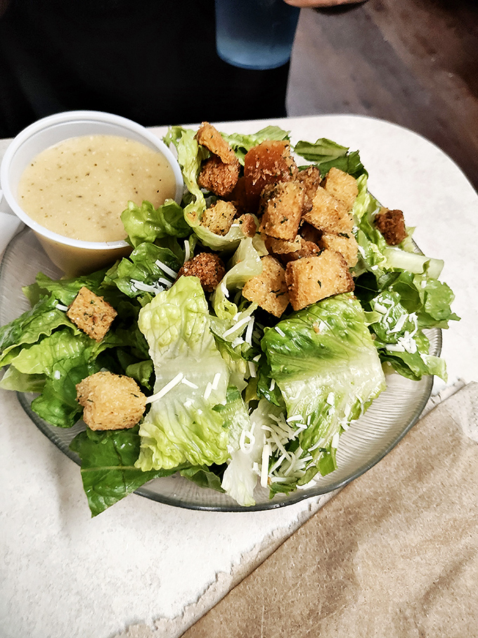Crisp romaine lettuce and seasoned croutons create the foundation for a classic Caesar salad that proves simple ingredients done right never go out of style.