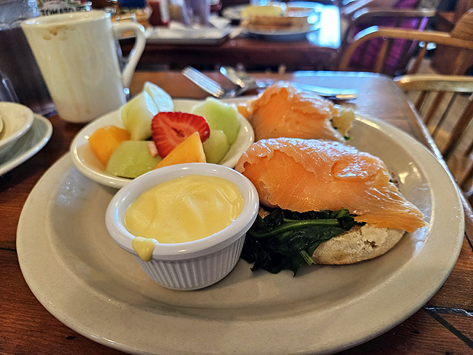 Salmon Benedict that puts hotel brunch buffets to shame. That hollandaise looks like liquid sunshine, and the fresh fruit side isn't an afterthought.