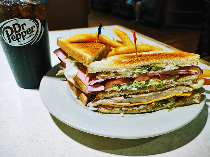 A club sandwich stacked higher than some Ohio apartment buildings, with layers of fresh ingredients that make lunch feel like a celebration.