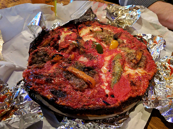 Half-eaten pizza is beautiful pizza. That wooden-handled spatula has probably served more joy than most therapists in the Chicagoland area.