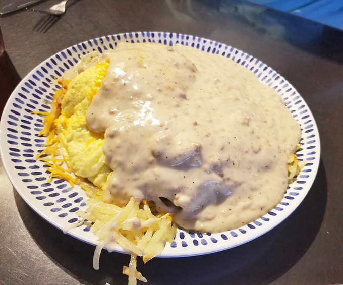 Sausage gravy that cascades over potatoes like a creamy waterfall. This is what breakfast dreams are made of, folks.