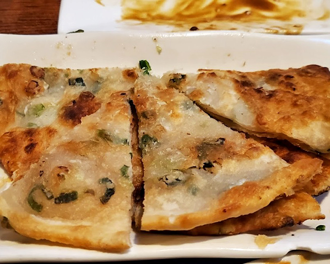 Scallion pancakes so crispy, they shatter like autumn leaves but taste infinitely better than yard work.