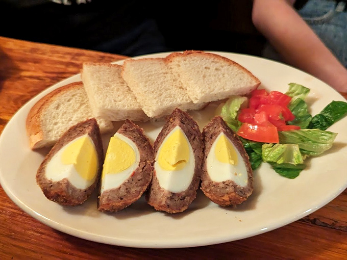 Scotch Eggs done right – perfectly boiled eggs wrapped in savory sausage, served with fresh bread and salad. Breakfast, lunch, or dinner? Yes to all three.