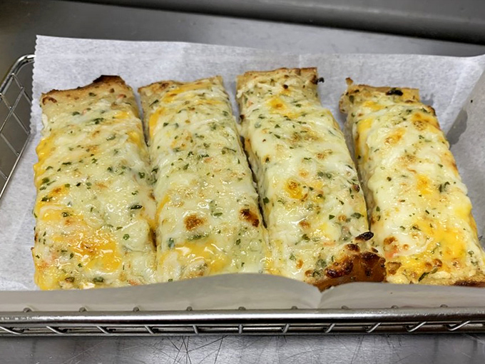 Garlic bread that glows like edible gold. The perfect tool for soaking up every last drop of that precious seafood butter.