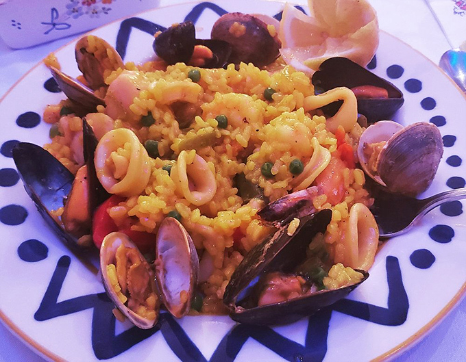 The seafood paella arrives like an edible treasure chest&mdash;clams and mussels popping open as if to say, "Surprise! You've made an excellent decision today!"
